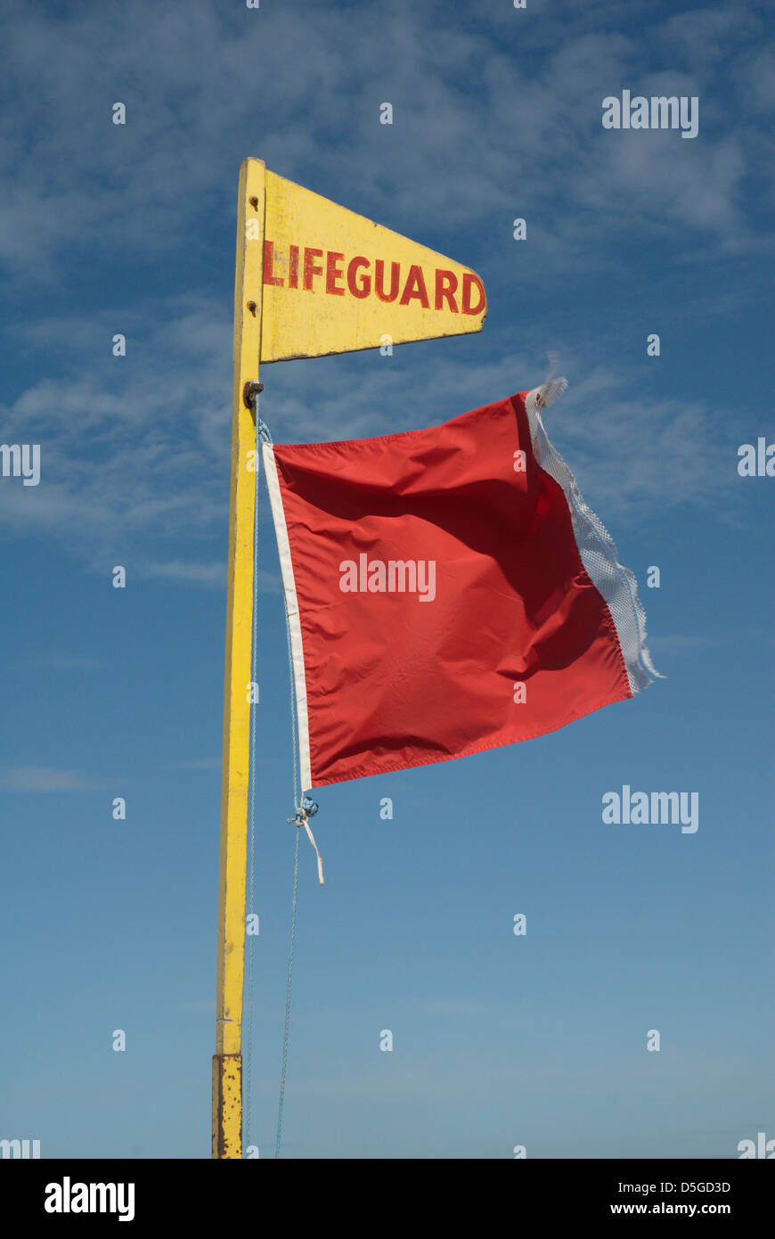 Lifeguard station hoists a red flag Stock Photo - Alamy
