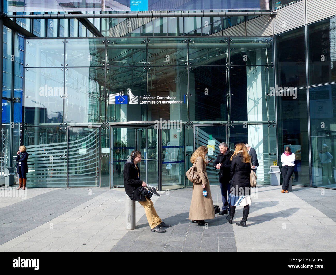 People in front of the European Commission office building in Brussels ...