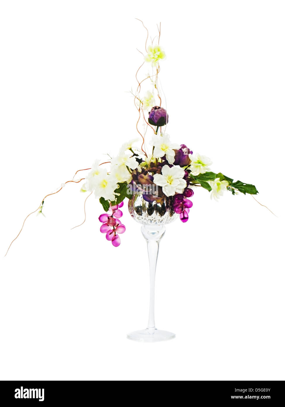 Floral arrangement from artificial flowers in glass goblet isolated on ...