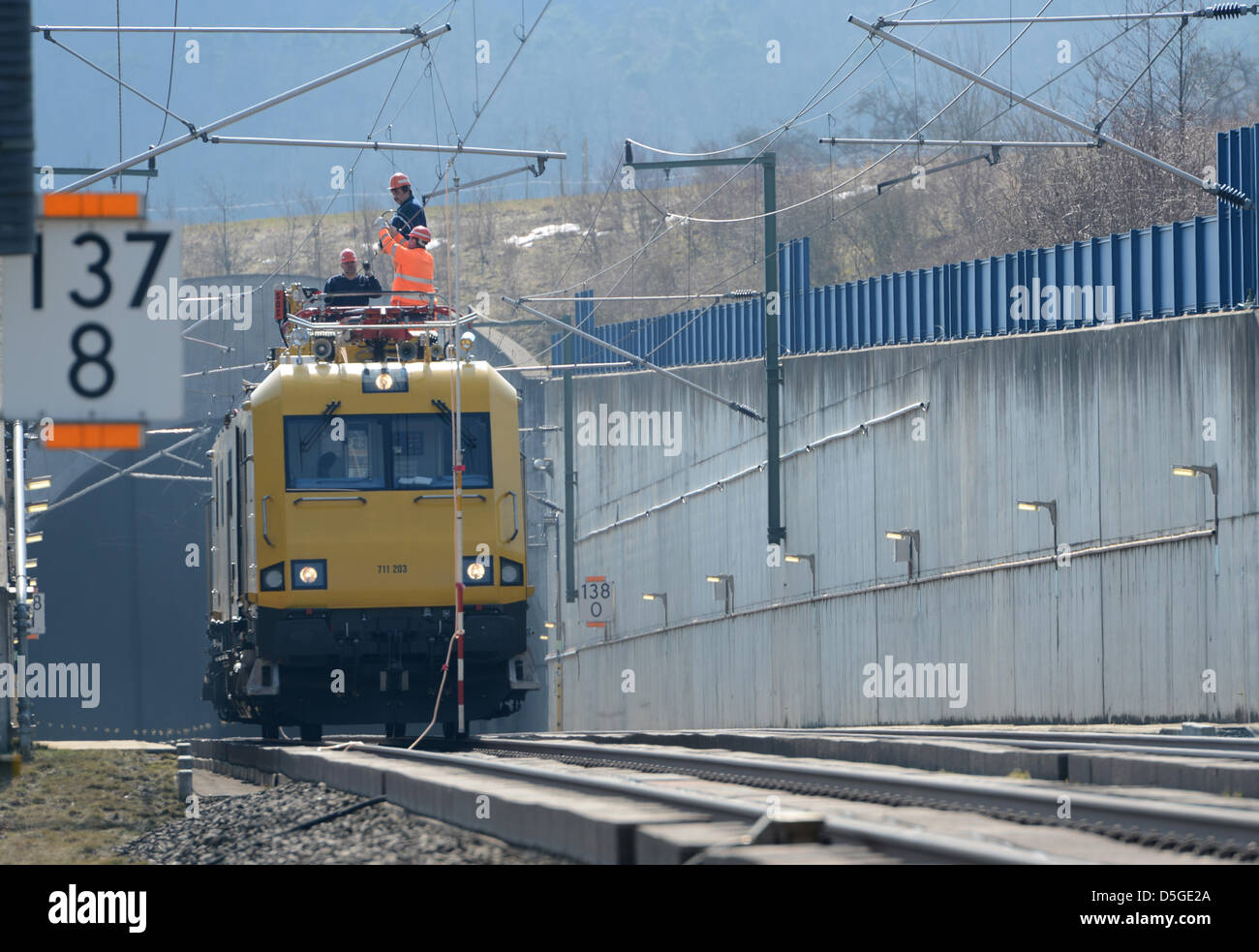 Workers of the German railways repair the overhead wire in front of the ...
