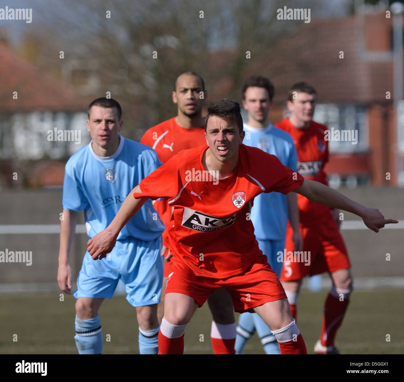 football action during a semi-professional match bewteen maine road fc ...