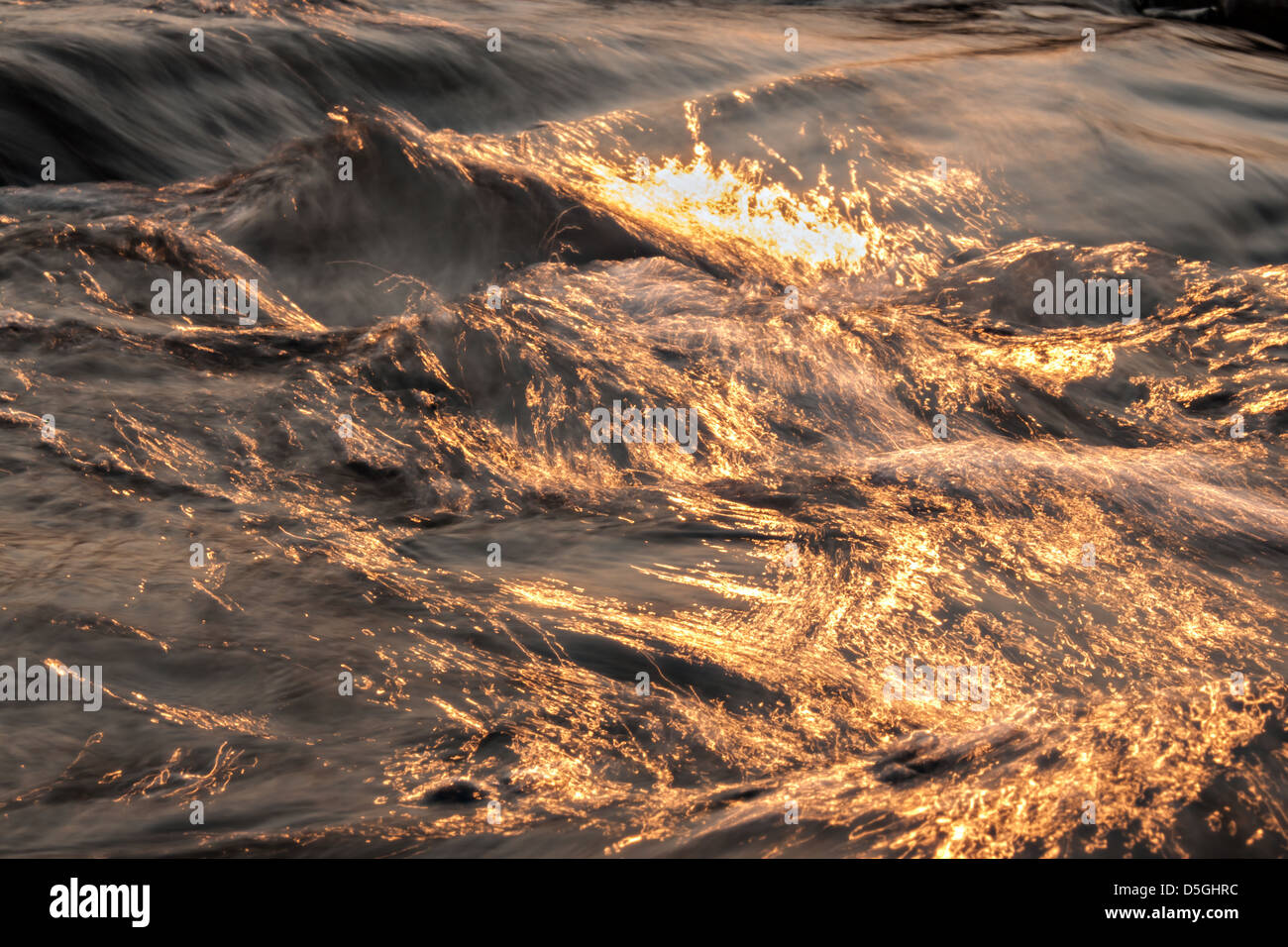 Sunset Reflection on River - Golden spray created by the setting sun ...