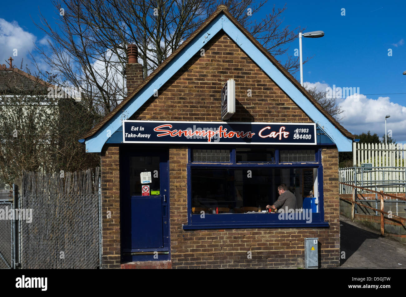 A roadside "Greasy Spoon" transport Cafe with a man visible in the ...