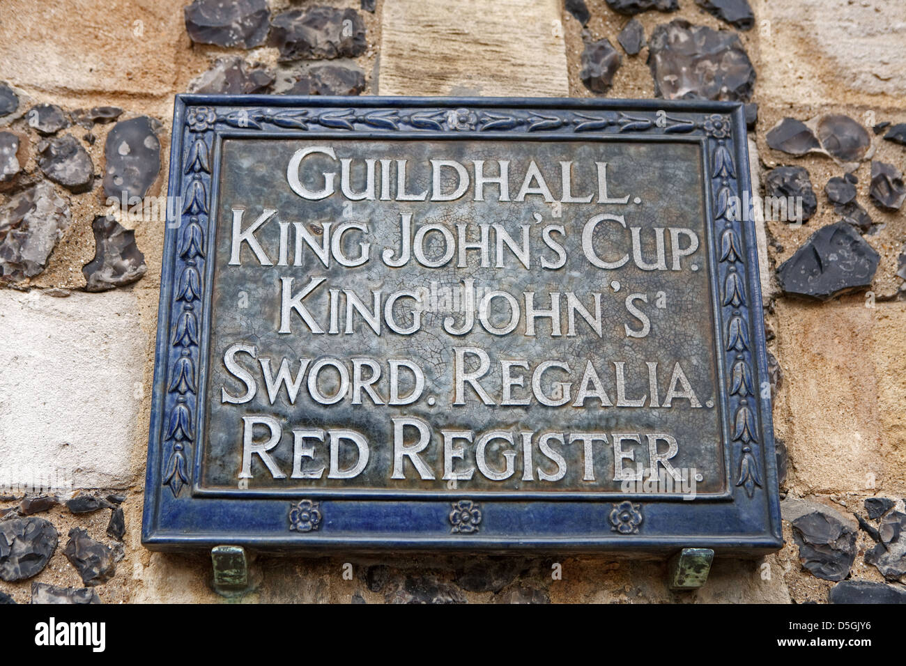The Guildhall Sign in Kings Lynn Norfolk England on a chequered wall ...