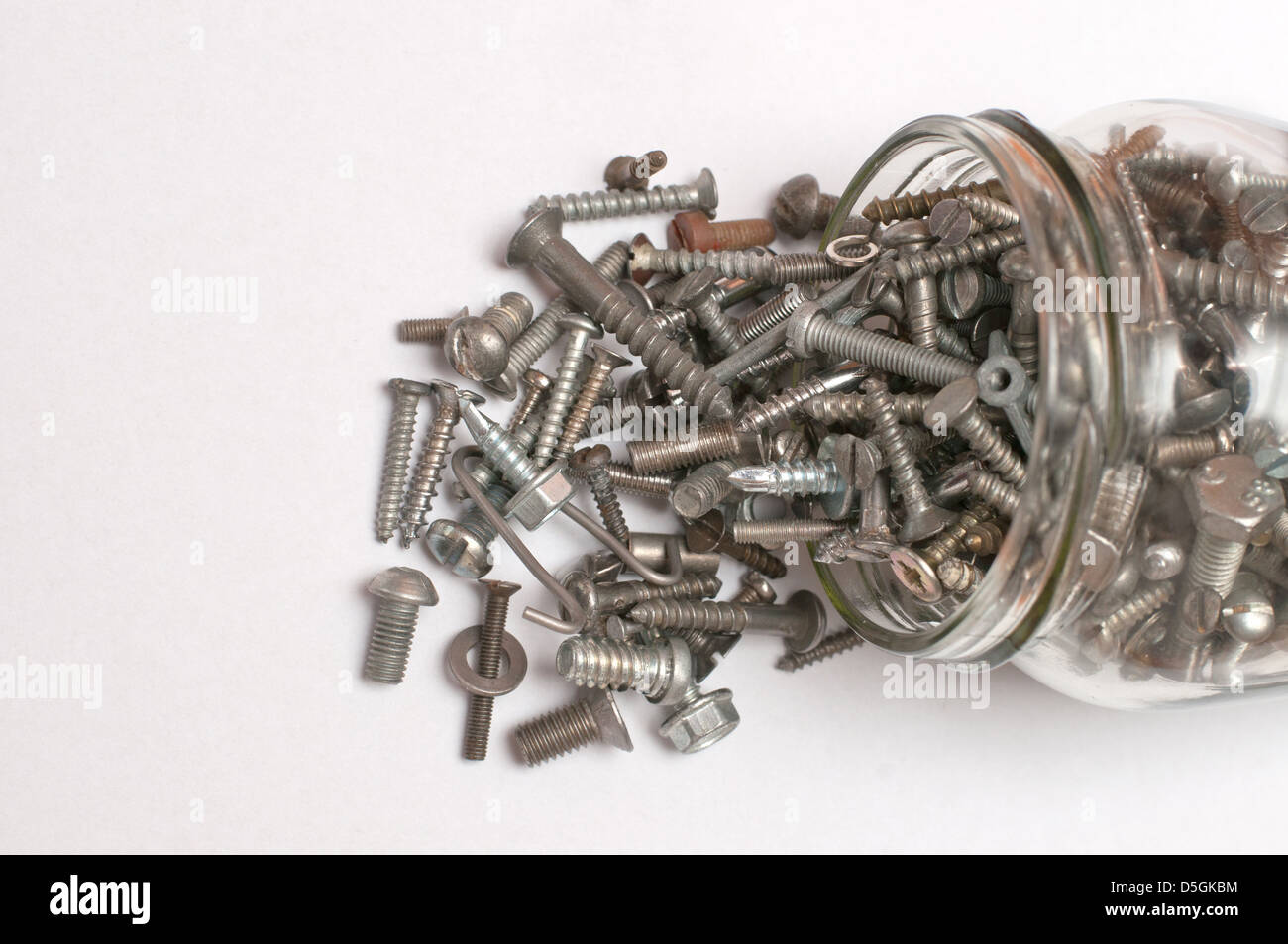 spilling old screws Stock Photo - Alamy