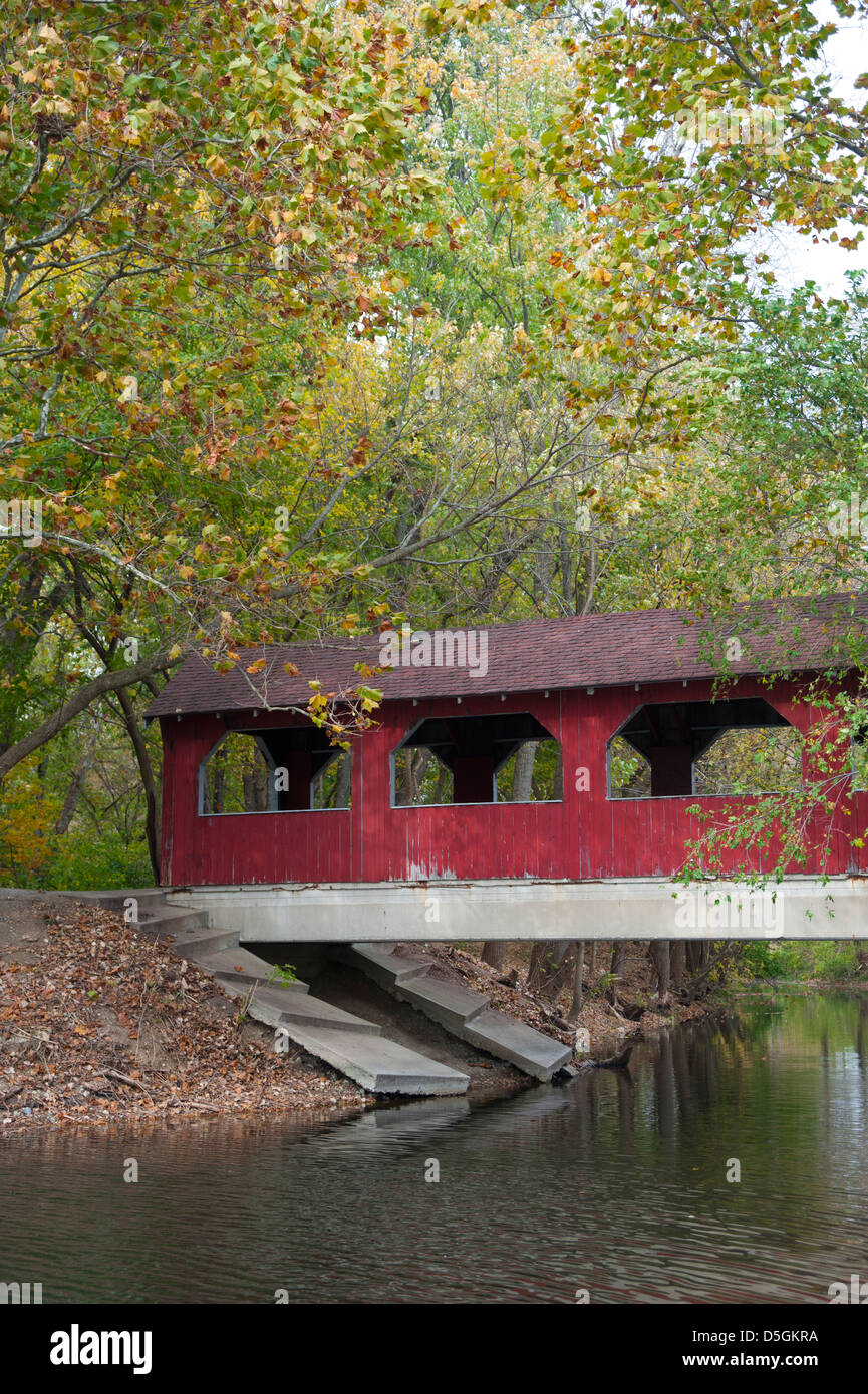 A small red covered bridge shows a bit of wear and tear, but the autumn ...