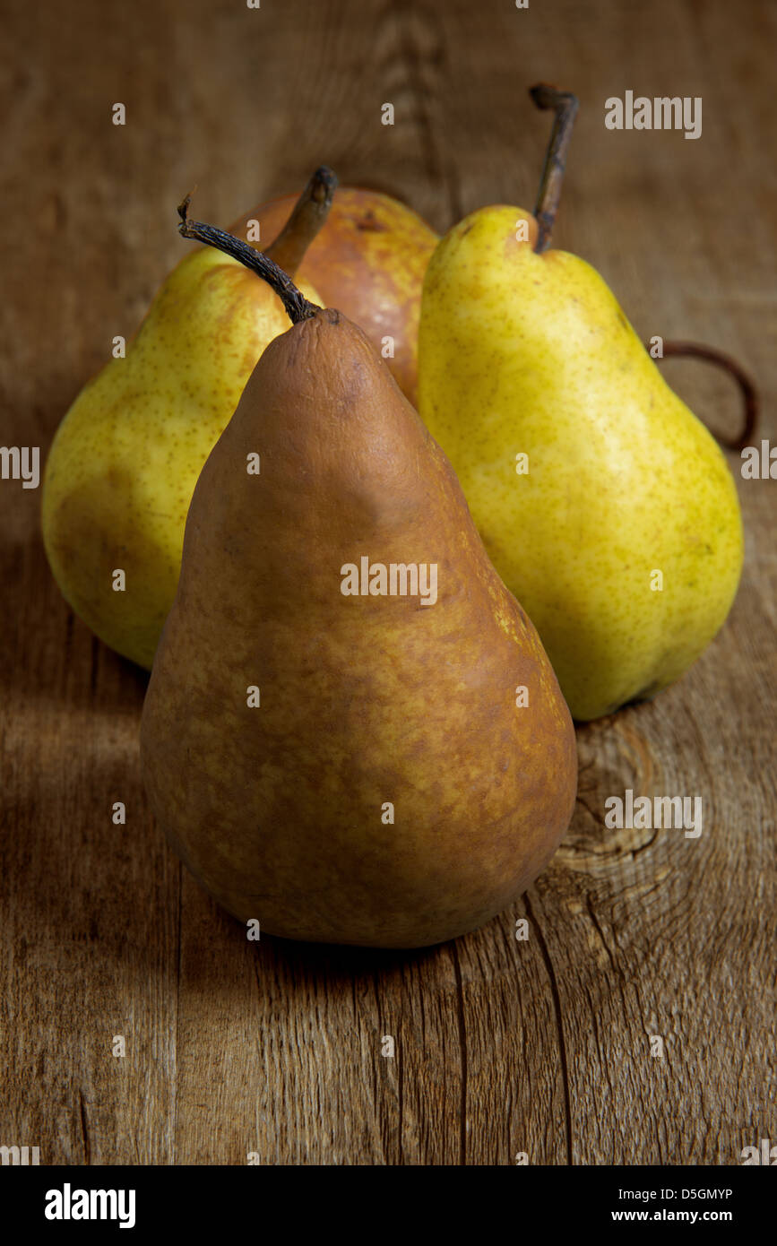 pear and nut on wooden table Stock Photo - Alamy