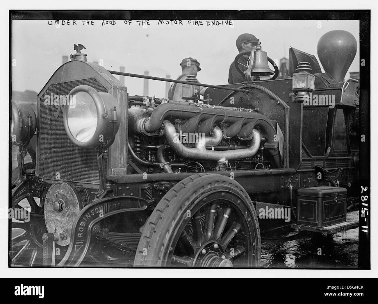 A 1913 photograph showing the engine compartment of a motor fire engine ...
