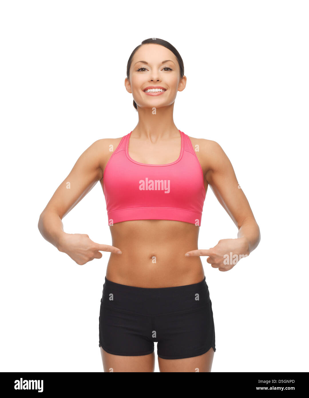 beautiful sporty woman pointing at her six pack Stock Photo - Alamy