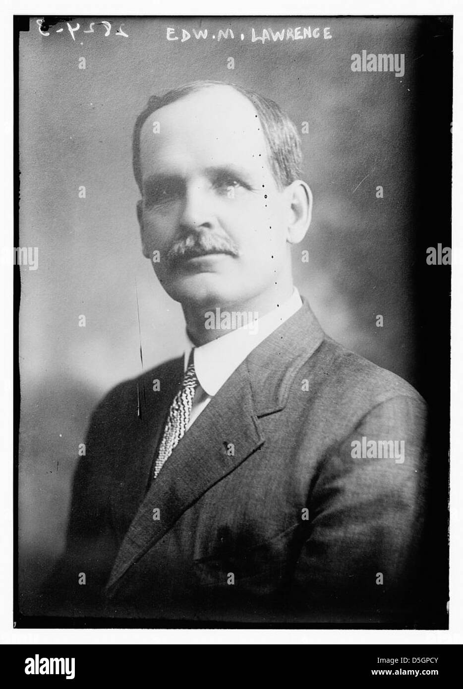 A portrait of Edw. M. Lawrence, showing a balding man with a mustache ...