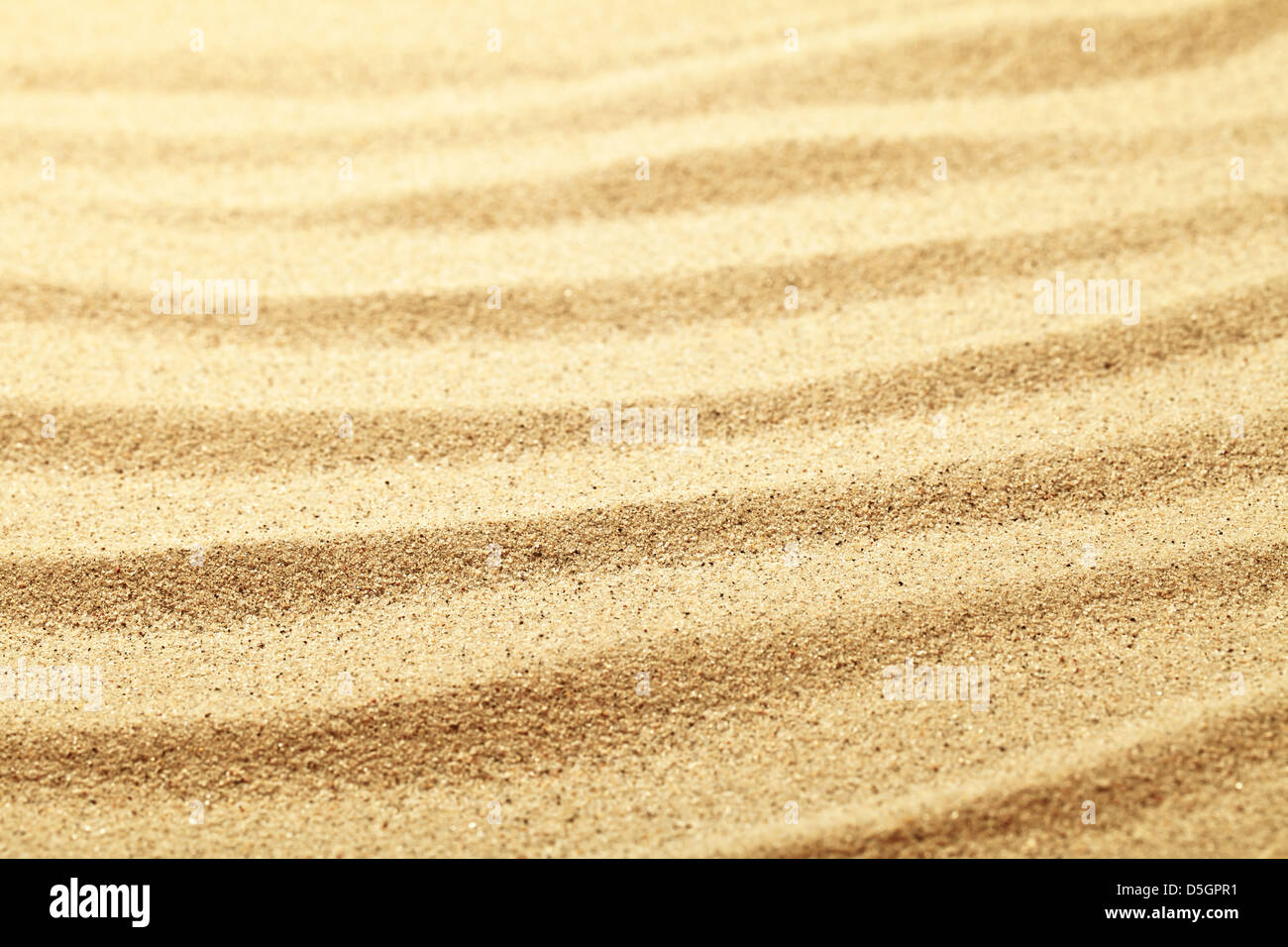 Sand background. Sunny summer beach close up view Stock Photo - Alamy