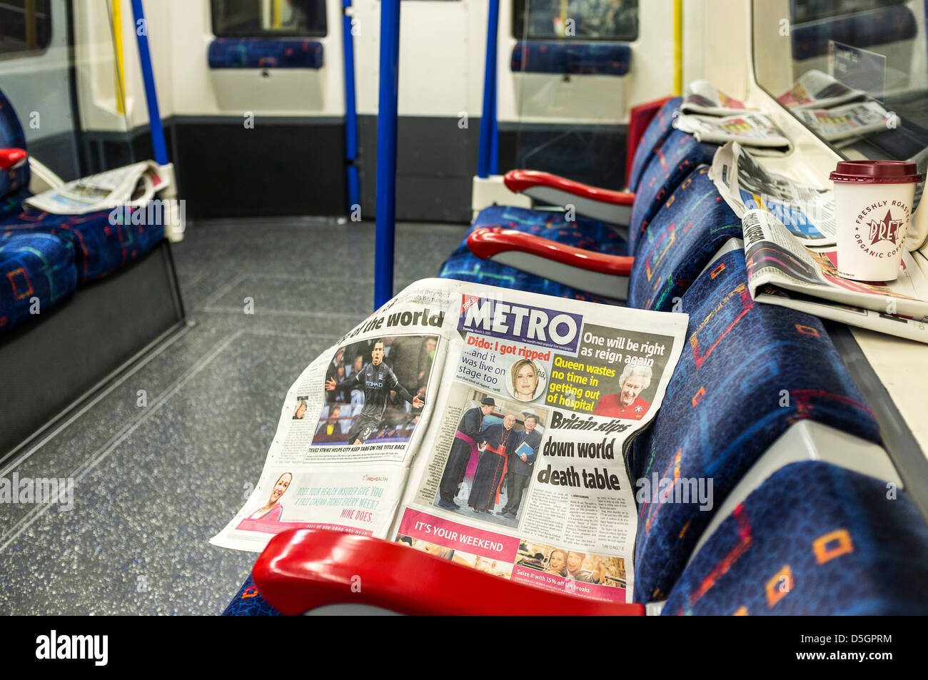 Free newspapers left on a London Underground carriage Stock Photo - Alamy