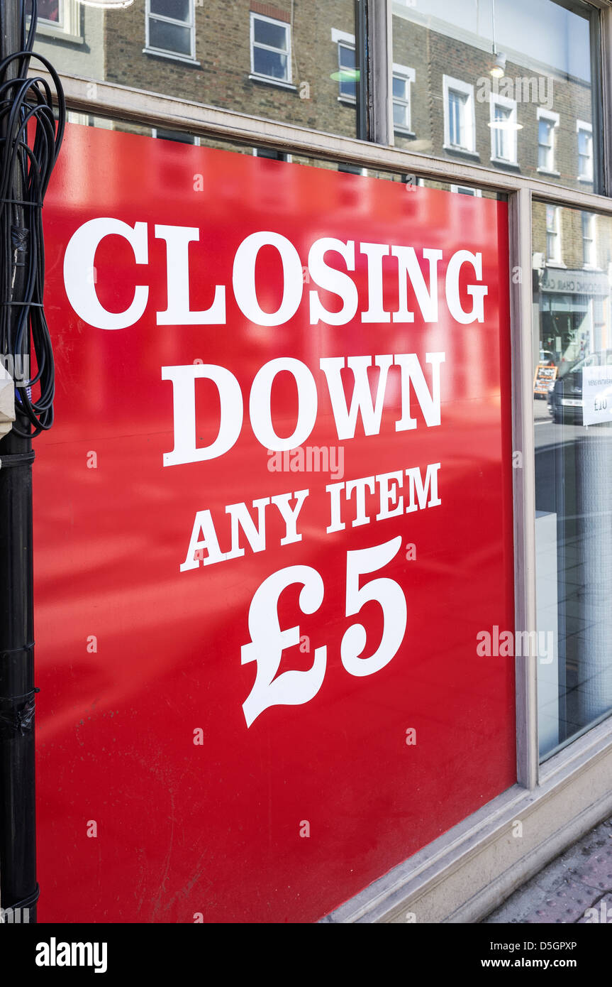 A closing down sign in a shop window Stock Photo - Alamy