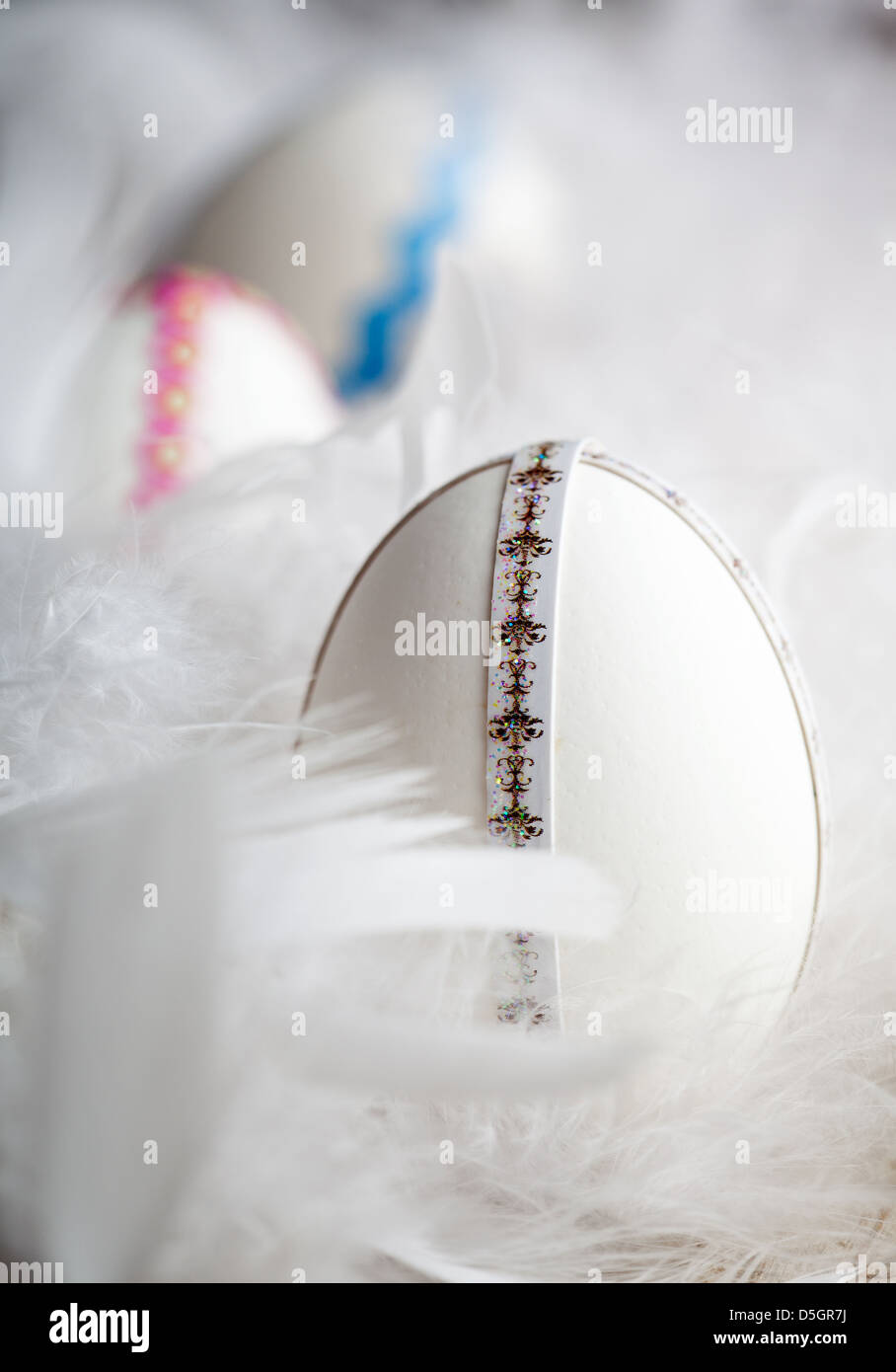 White easter eggs decorated with colorful stickers Stock Photo - Alamy