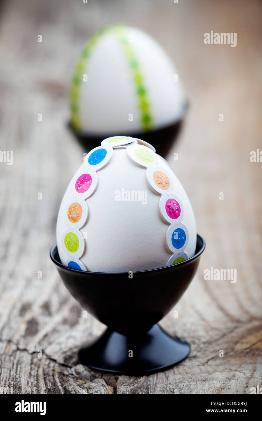 White easter eggs decorated with colorful stickers Stock Photo - Alamy