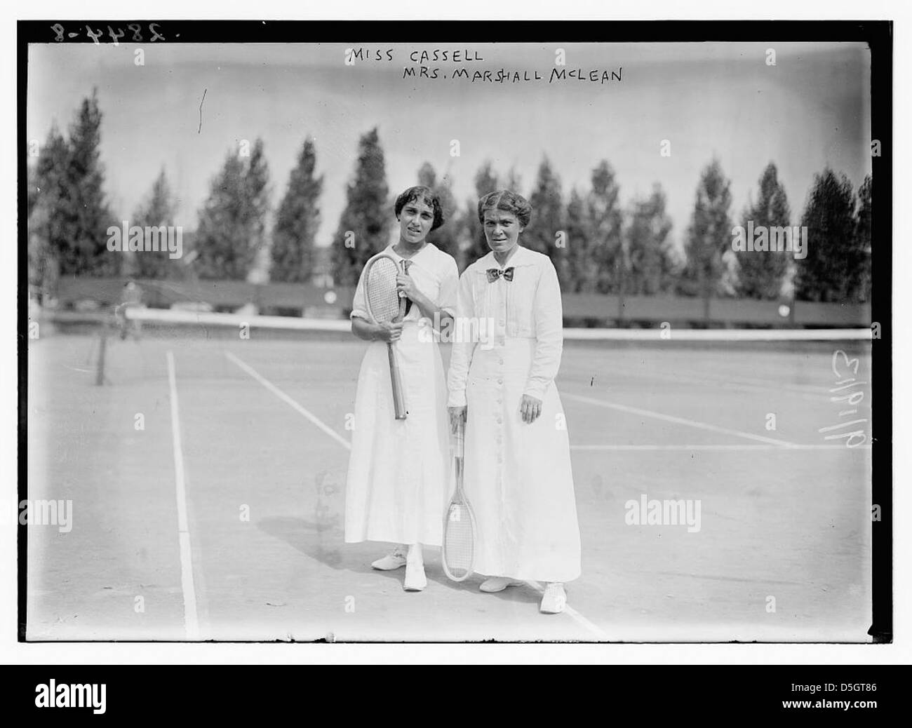 Miss Cassell and Mrs. Marshall McLean are shown on a tennis court in ...
