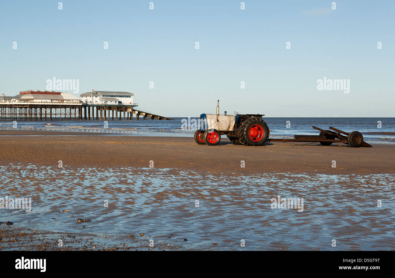 A tractor and trailer waiting for the return of a crab boat on the ...