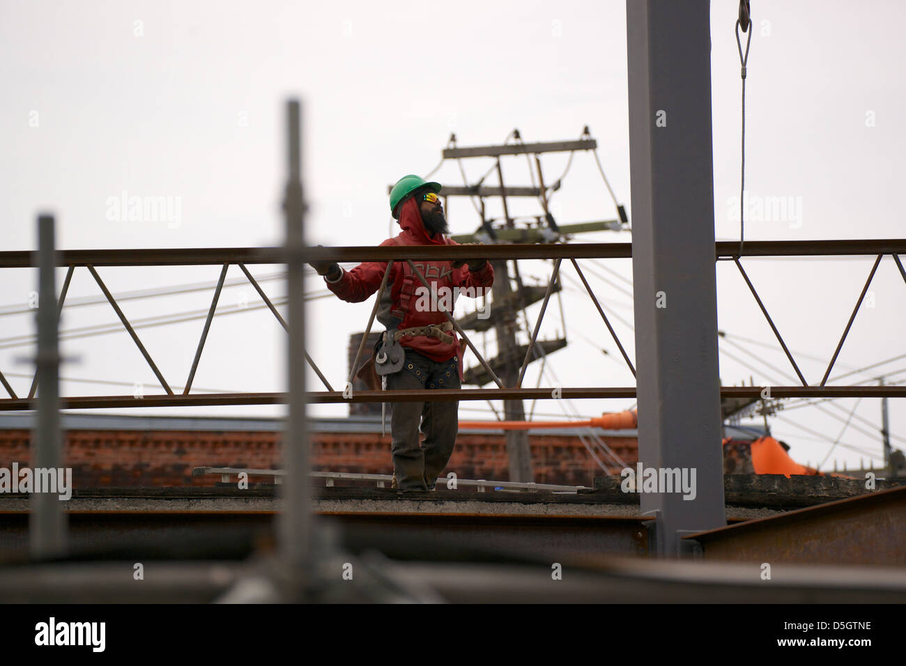 Ironworker on steel beams during construction of a building Stock Photo ...