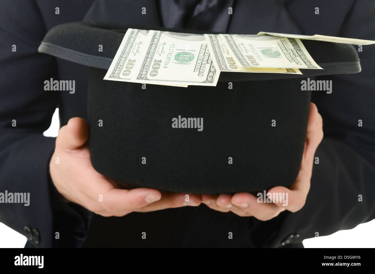 Dollar paper money cash in a hat holded by man in black suit Stock ...