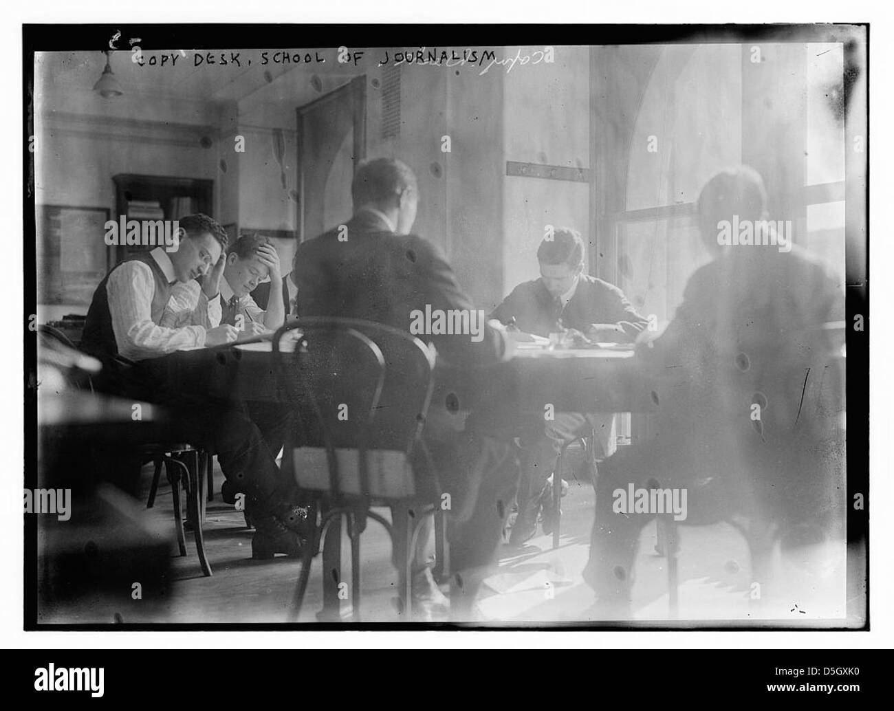 This 1940s image shows students working at the copy desk at Columbia ...