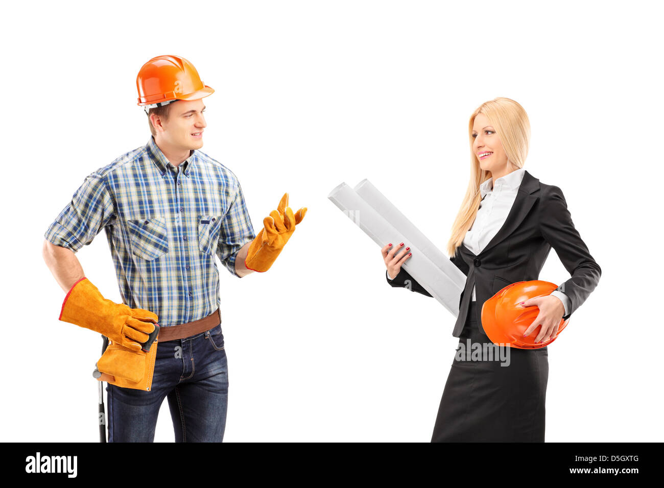 Male manual worker having a conversation with female architect ...