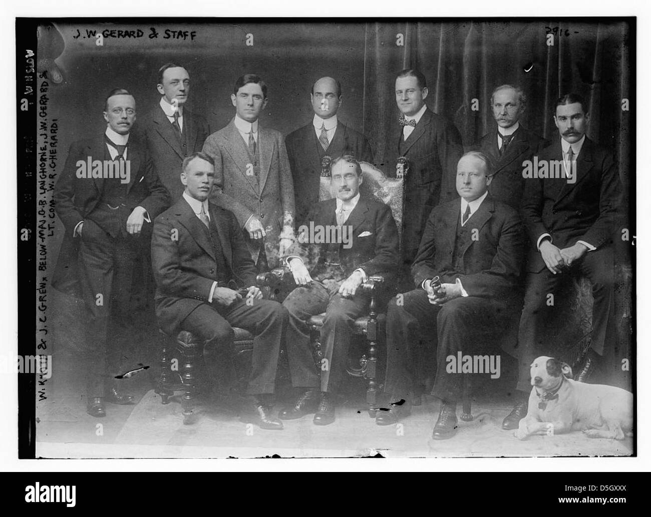 J.W. Gerard, along with his staff, is pictured in a formal portrait ...