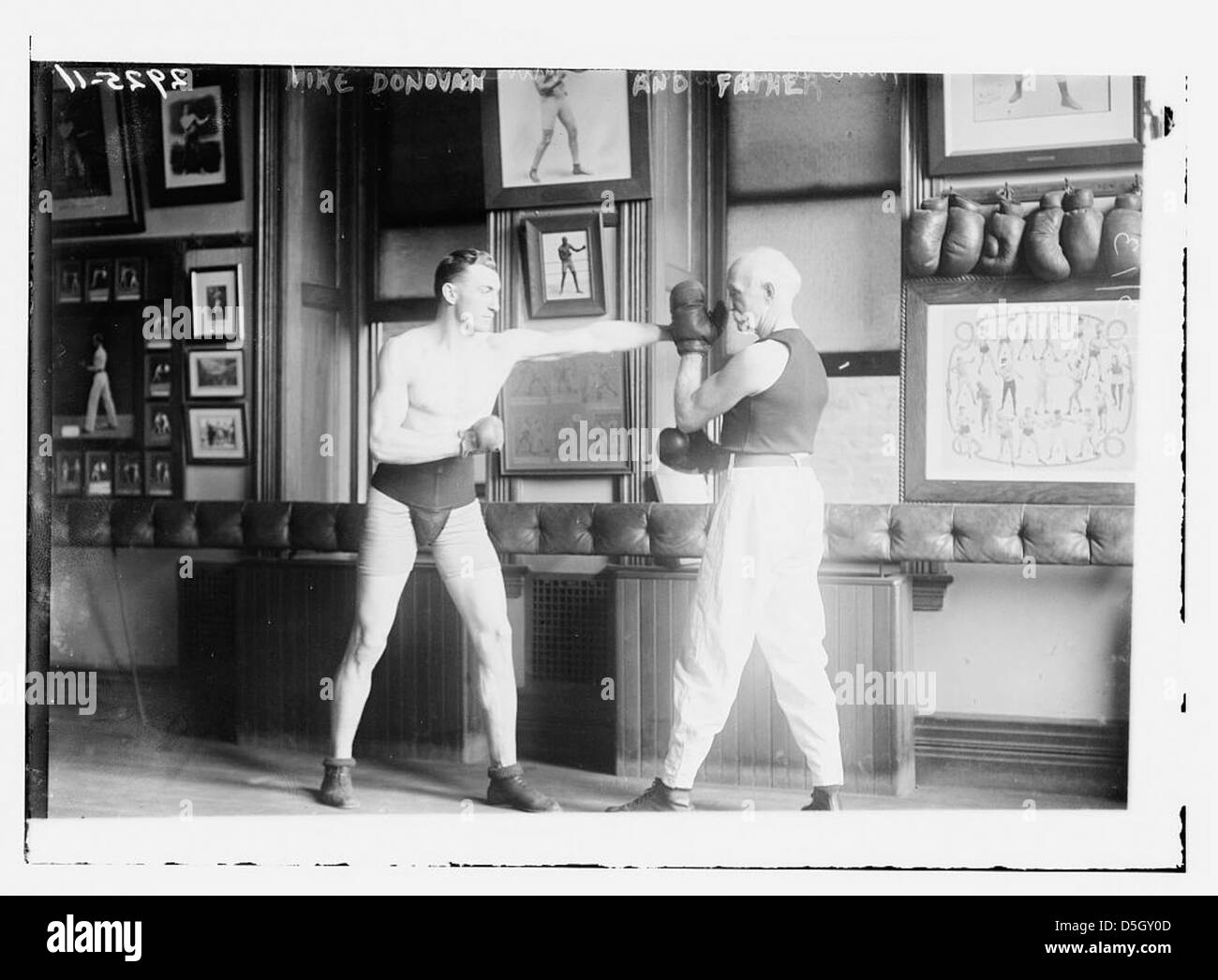 This image shows boxer Mike Donovan alongside his father, likely in a ...
