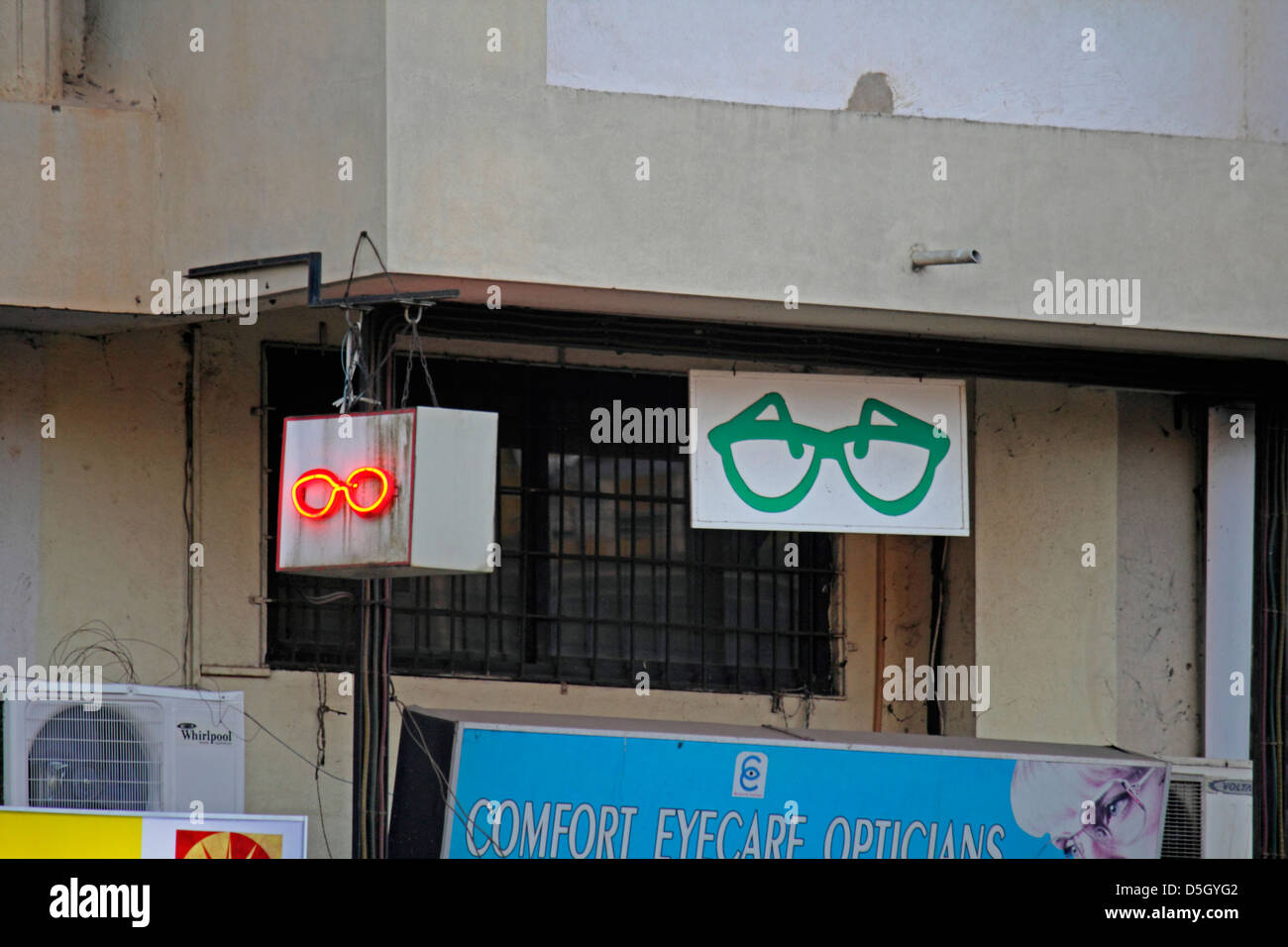 Optician's neon sign Stock Photo - Alamy