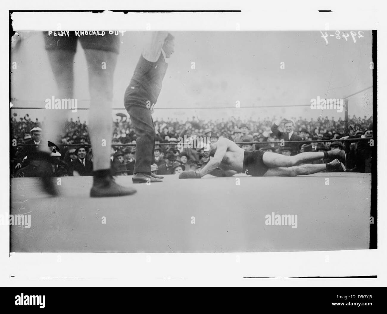 A dramatic photo from January 1, 1914, showing boxer Arthur Pelkey ...