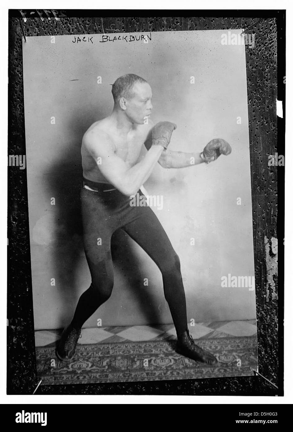 This photograph captures boxer Jack Blackburn, a key figure in early ...