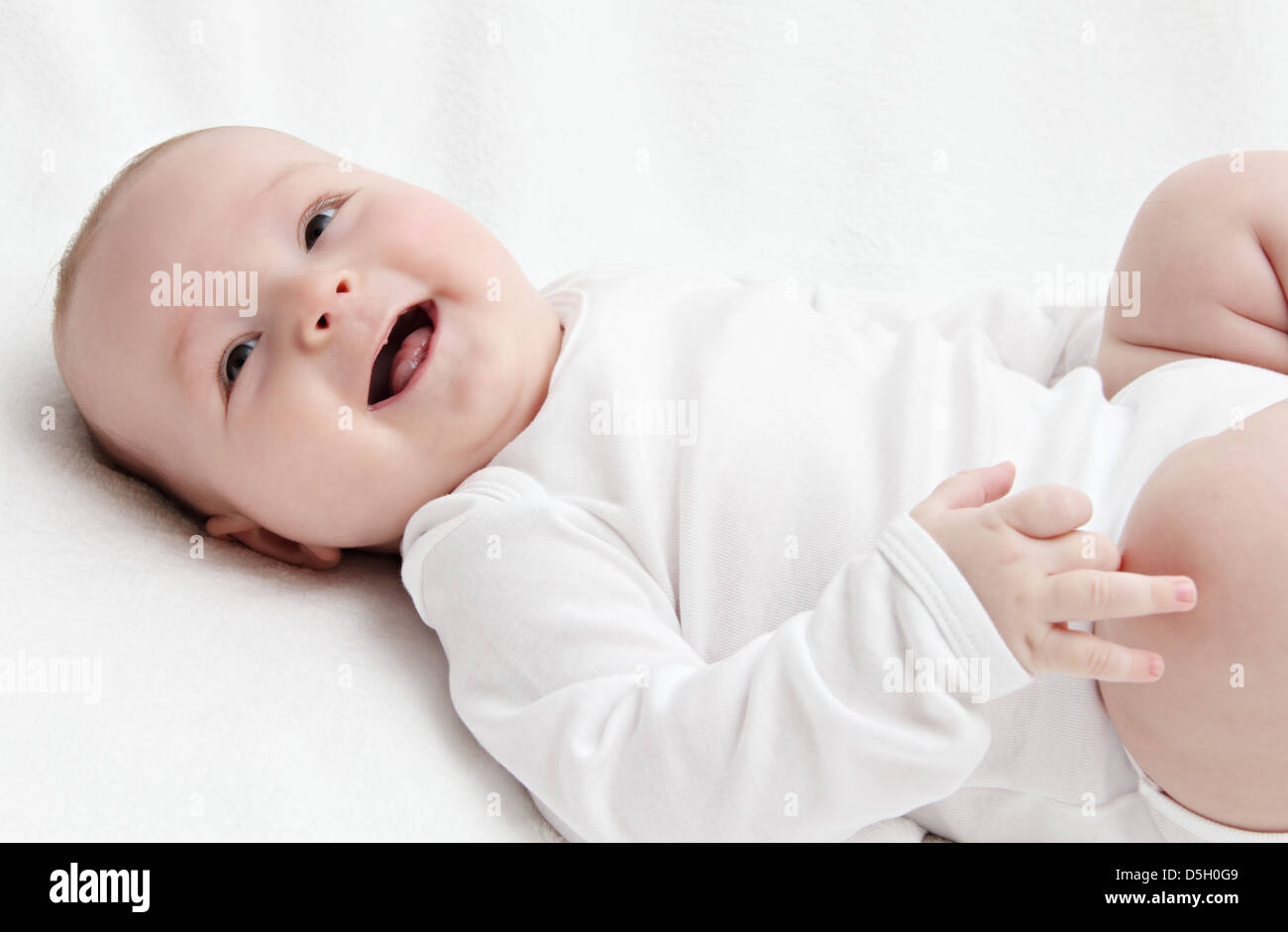 Happy baby on back Stock Photo - Alamy