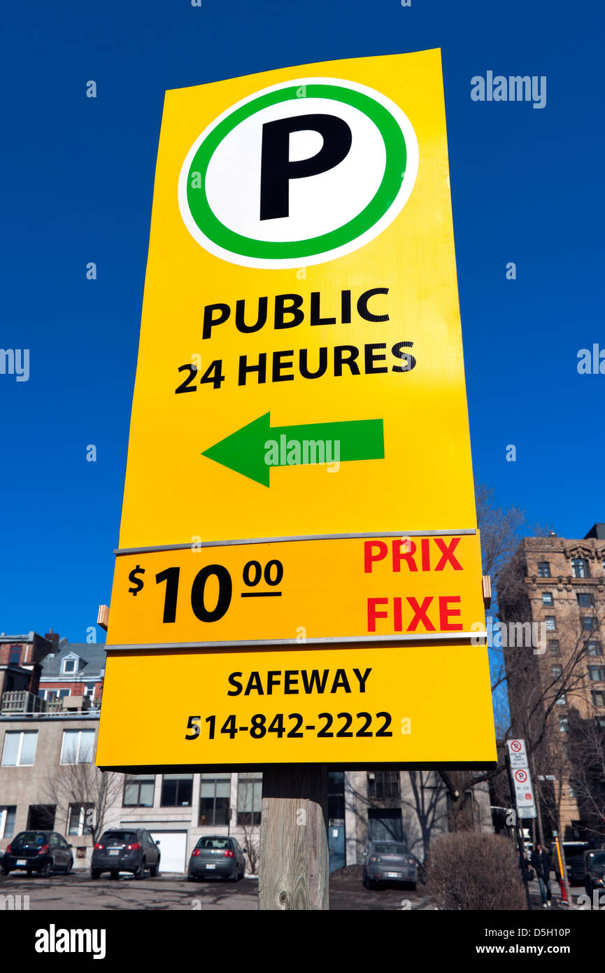 Yellow parking lot sign against blue sky in Montreal, province of ...