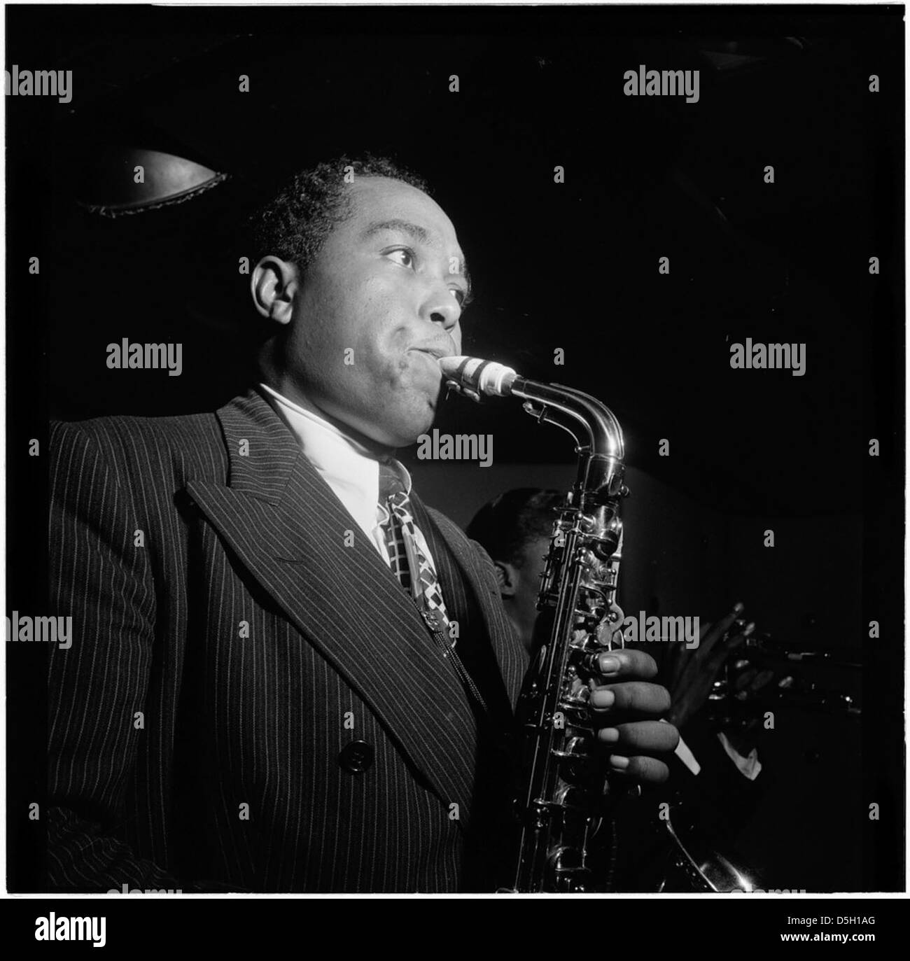 This portrait shows renowned jazz saxophonist Charlie Parker performing ...