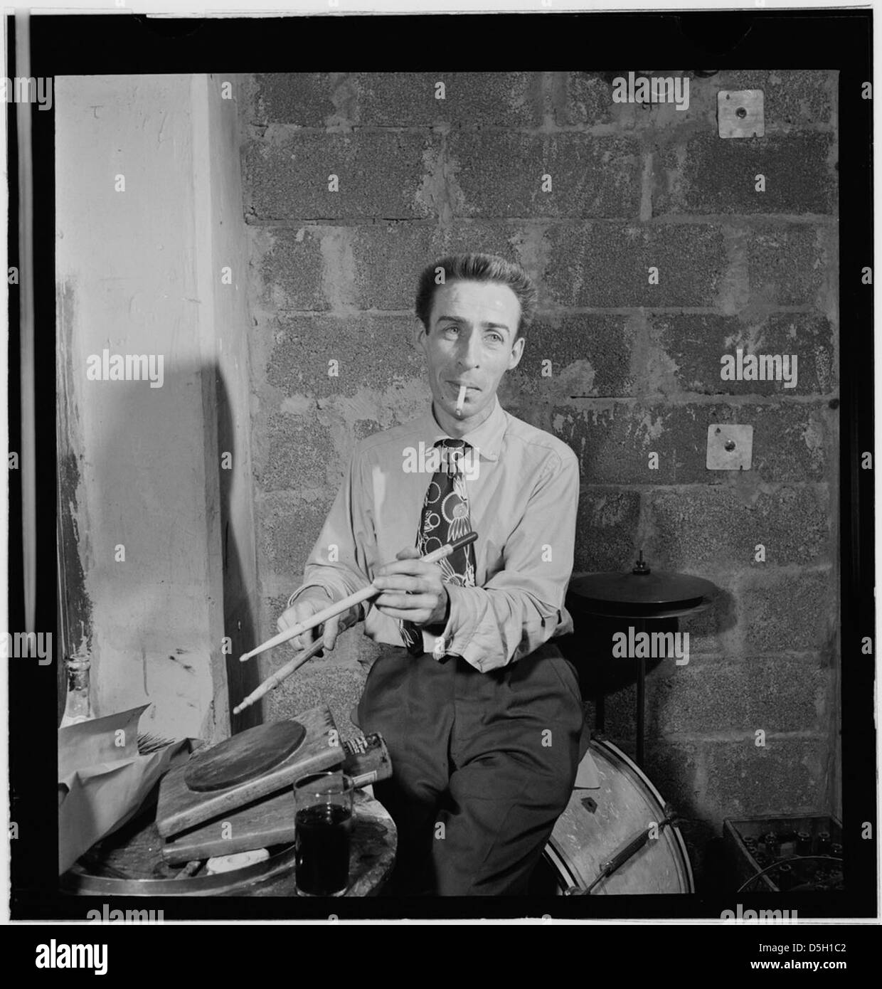 This portrait shows jazz drummer Dave Tough, taken in the basement of ...