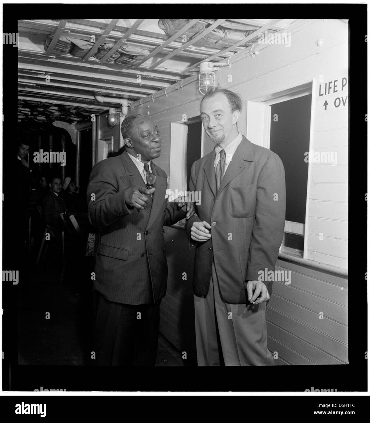 This 1947 photograph captures jazz musicians Rudi Blesh and Baby Dodds ...