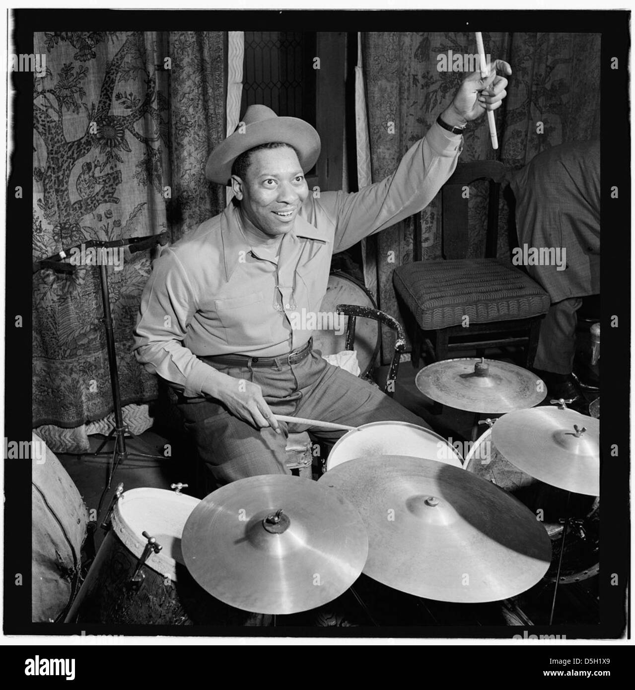 This portrait depicts Sid Catlett, a notable jazz drummer, in New York ...