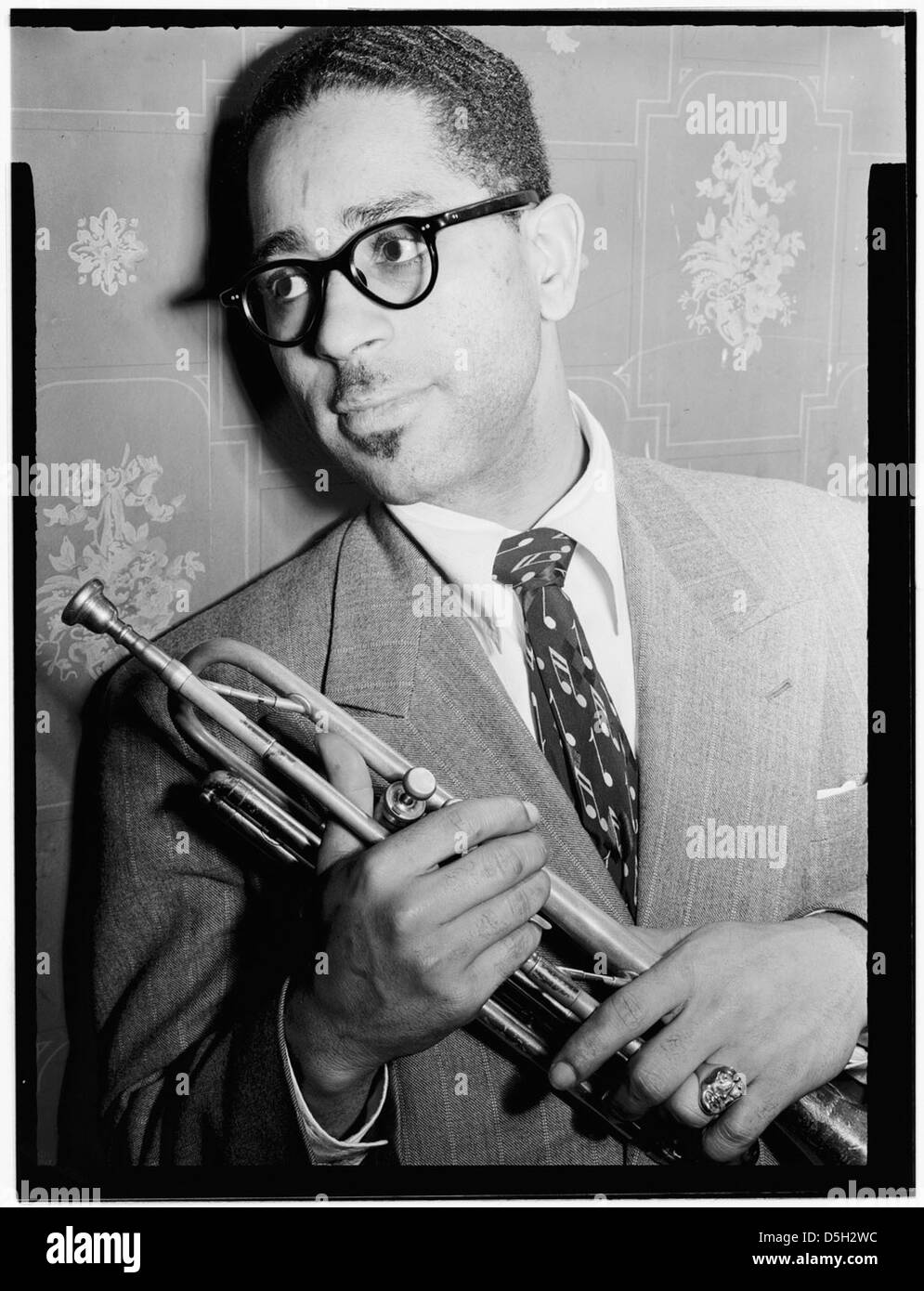 Dizzy Gillespie, the renowned jazz trumpeter, is captured in a portrait ...