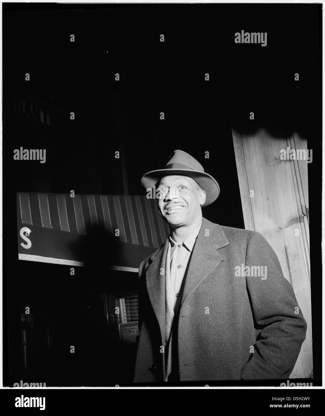 Tiny Grimes, an influential jazz guitarist, is captured in a portrait ...