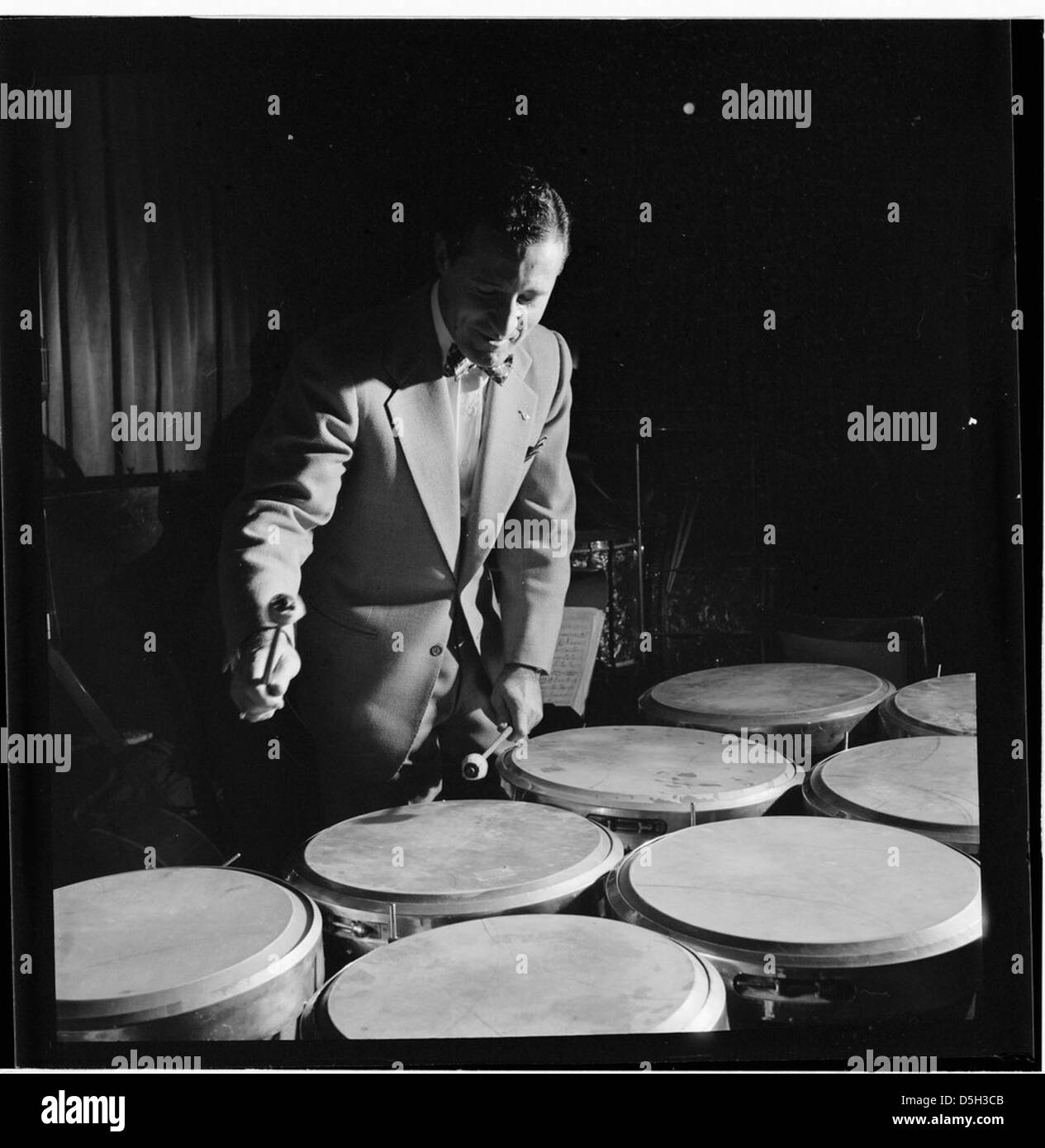 This portrait captures Ray McKinley, a notable figure in American jazz ...