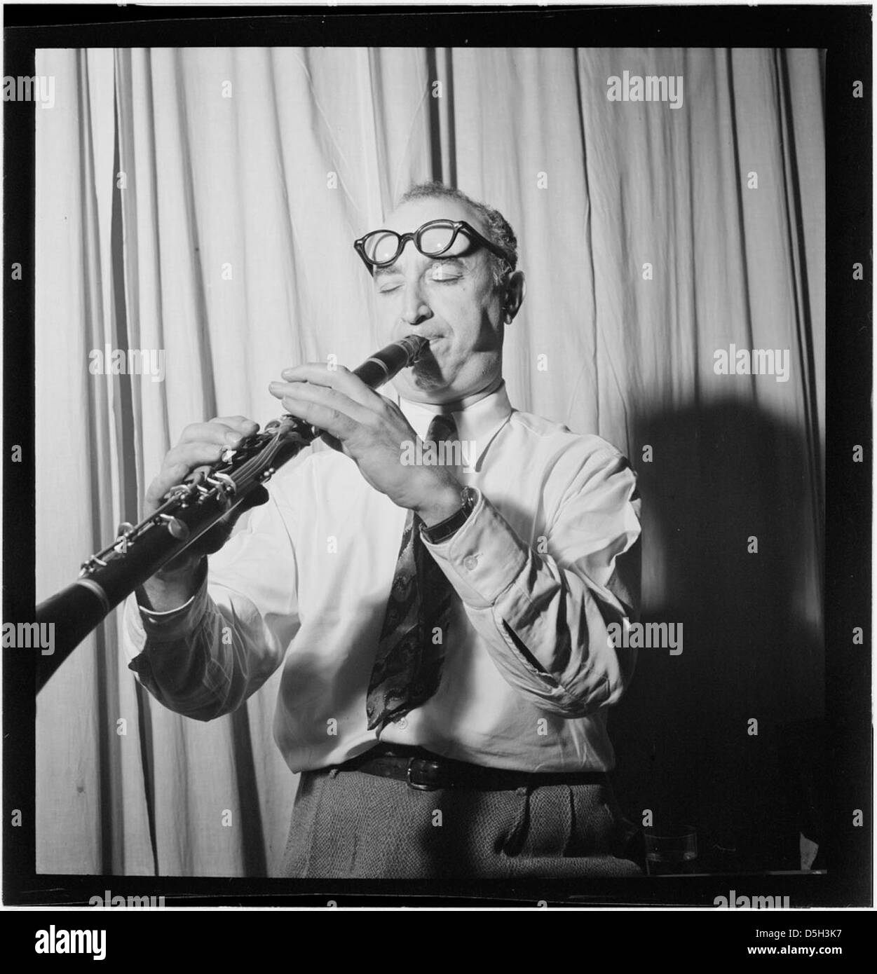 Mezz Mezzrow, a well-known clarinetist and jazz musician, is captured ...