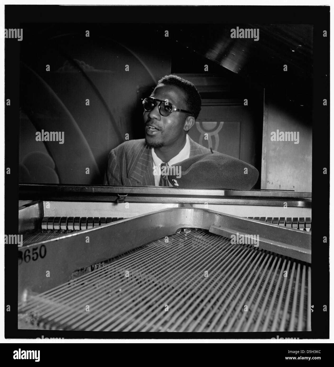 This iconic portrait shows jazz pianist Thelonious Monk performing at ...