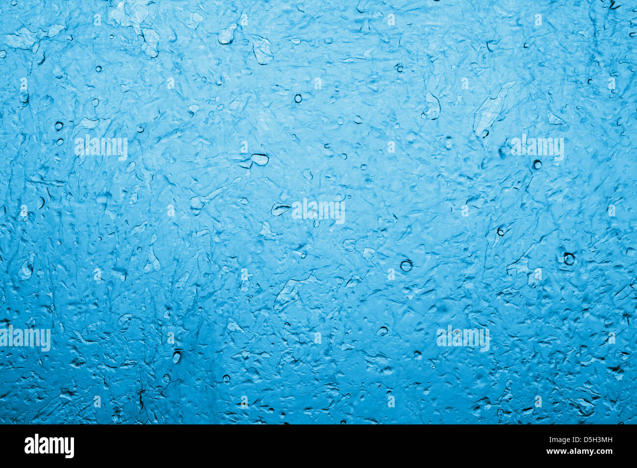 Water on blue light for background Stock Photo - Alamy