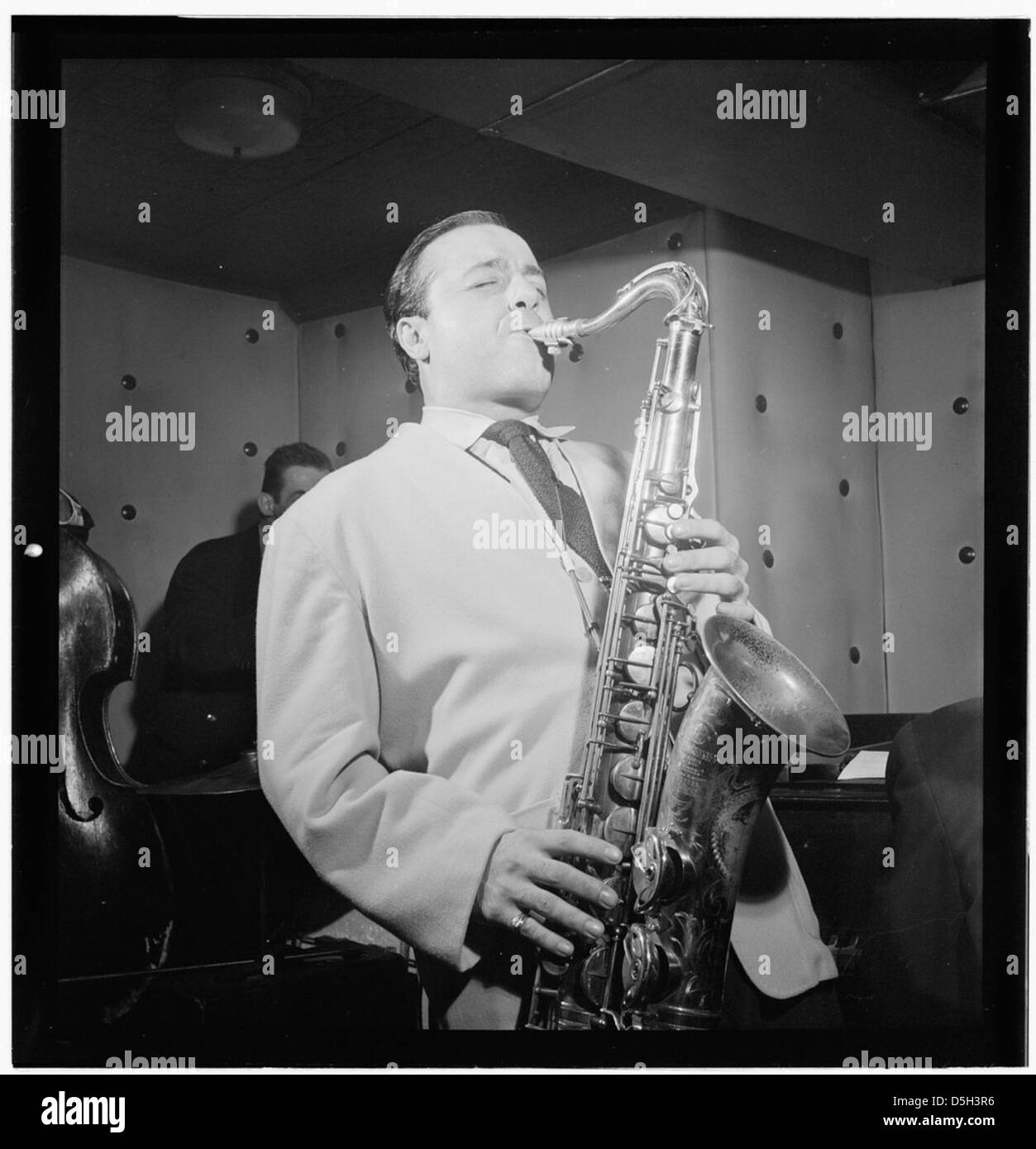 Jazz musician Flip Phillips is photographed playing saxophone at the ...