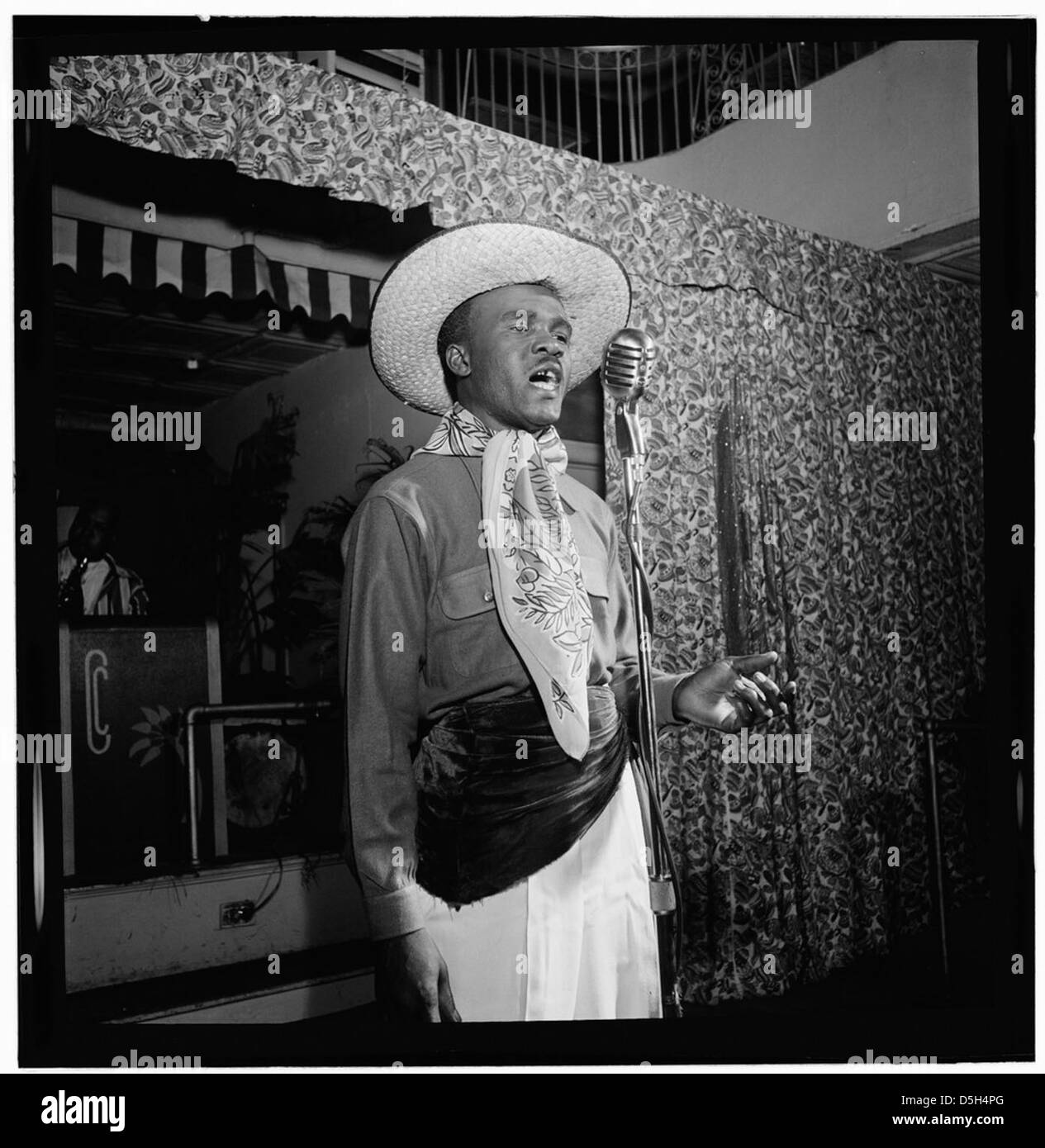 A portrait of a Calypso musician, dressed in traditional costume, taken ...