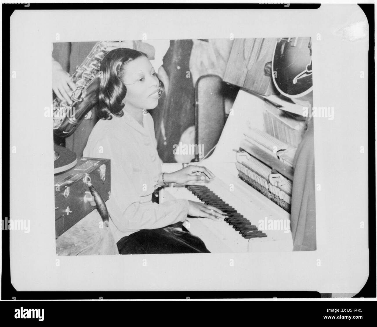 Mary Lou Williams, a renowned jazz pianist and composer, is captured in ...