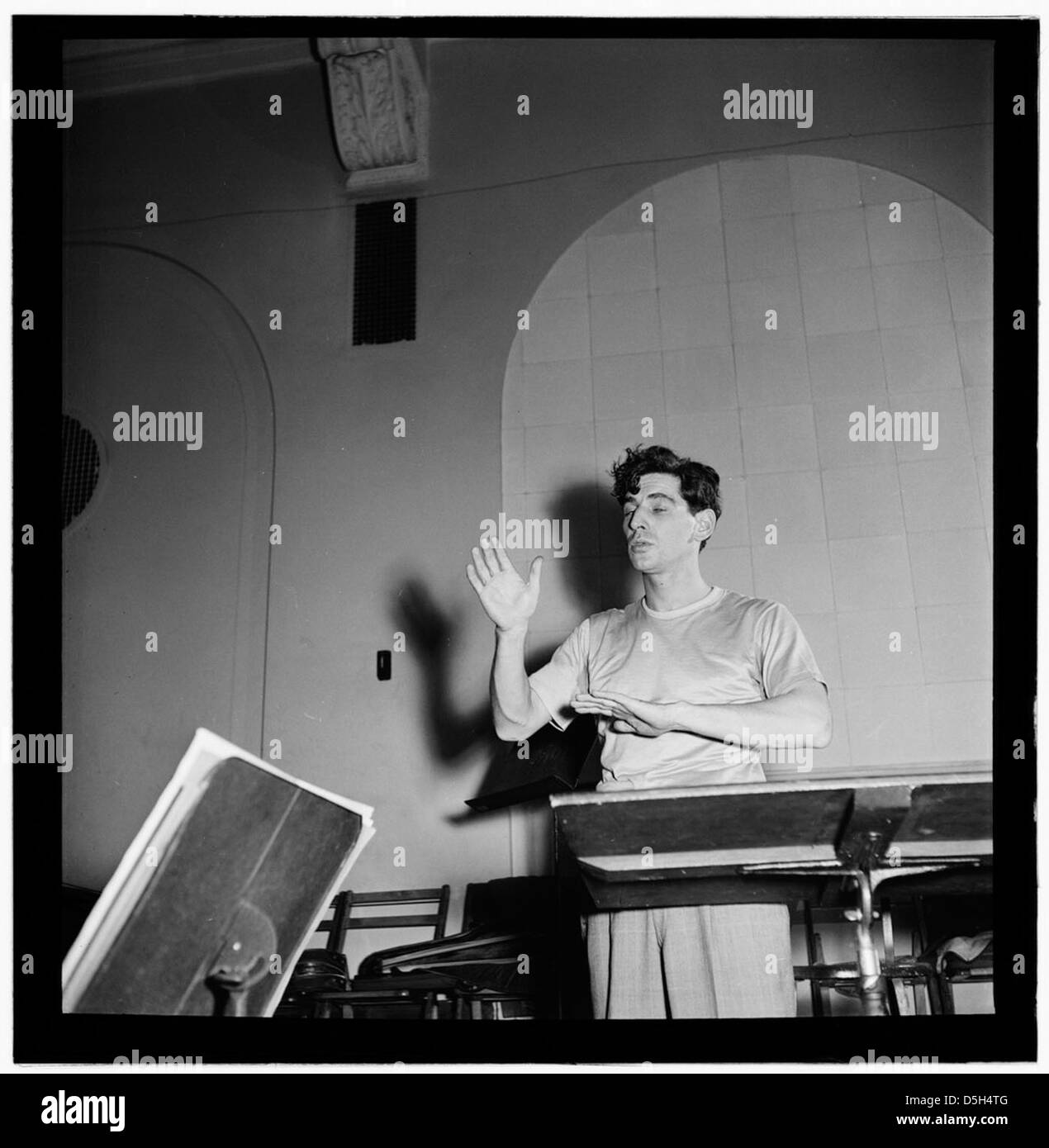 Leonard Bernstein, renowned conductor and composer, is captured in a ...