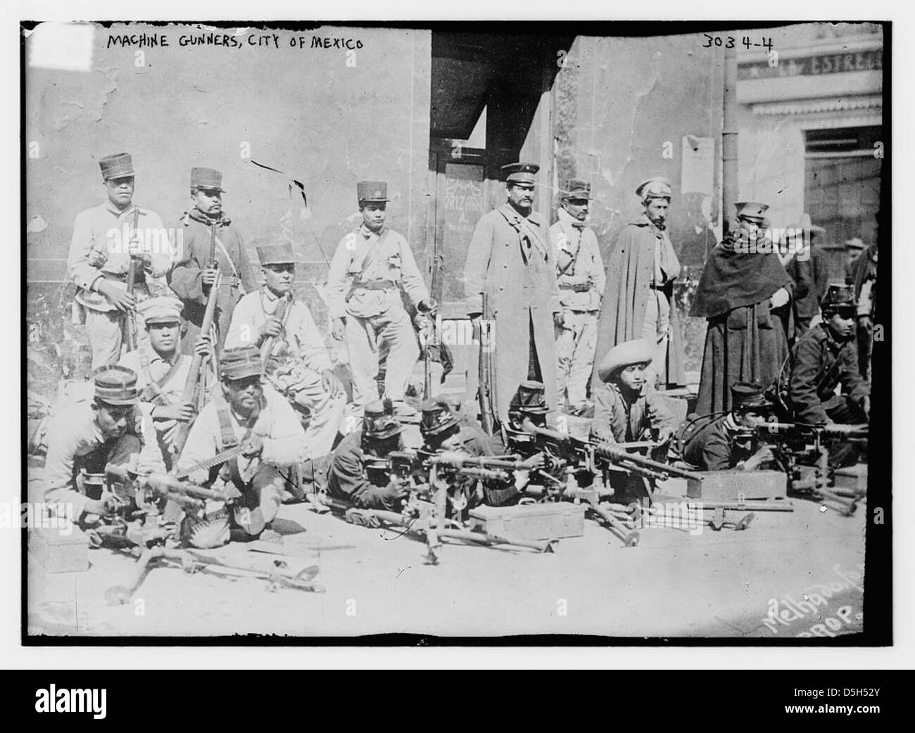 A photo of soldiers operating Hotchkiss machine guns in Mexico City ...