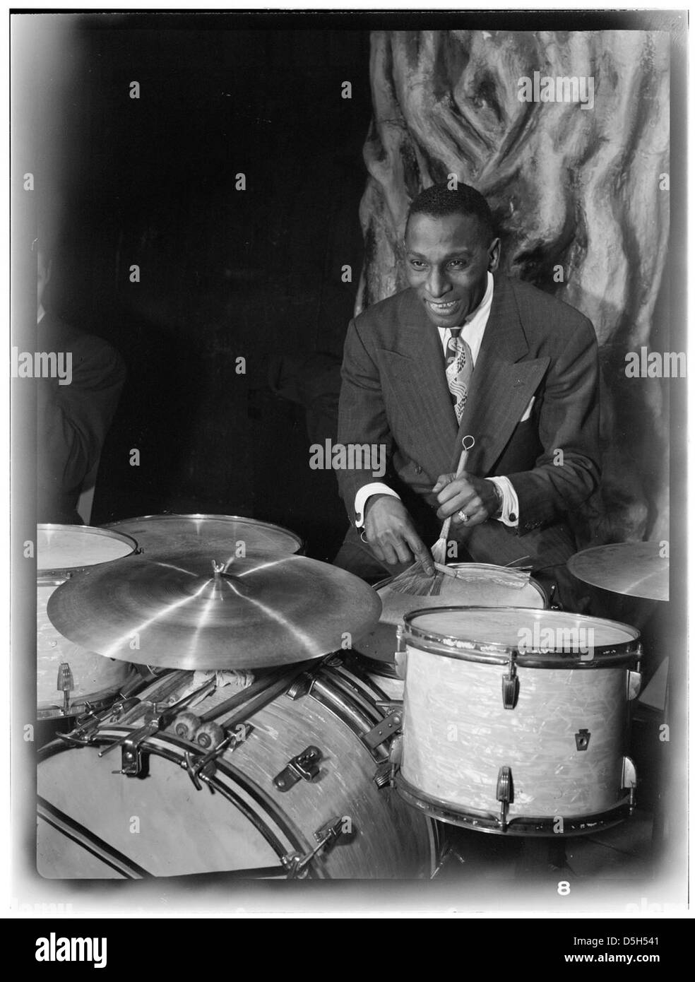 A portrait of Cozy Cole, a renowned jazz drummer, taken between 1938 ...