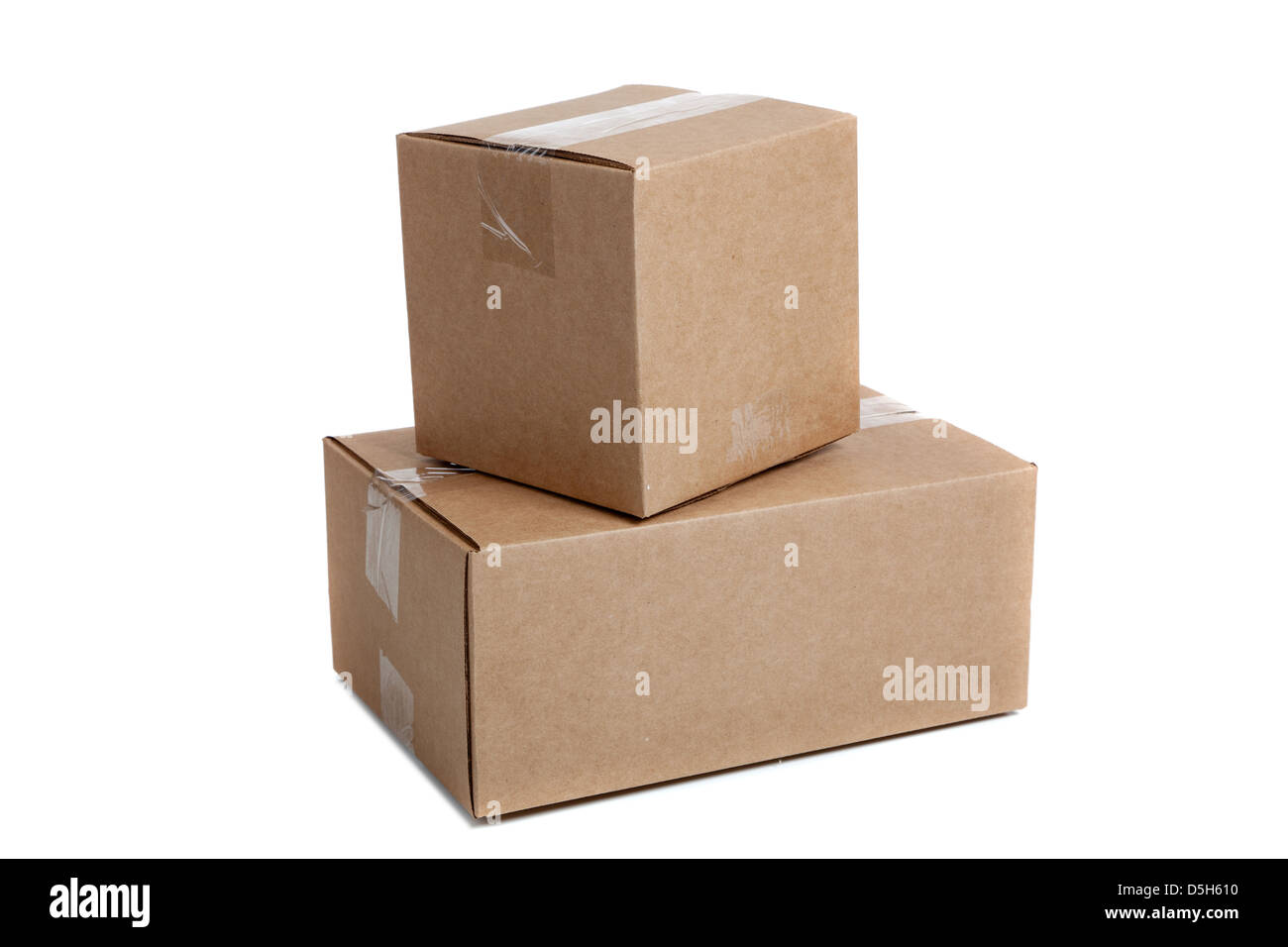 A stack of brown packing boxes on a white background Stock Photo - Alamy