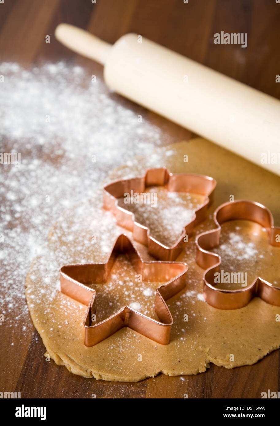 Baking christmas cookies with star and tree motif Stock Photo - Alamy